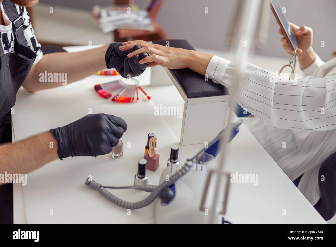 Woman having manicure beauty salon hi-res stock photography and images ...