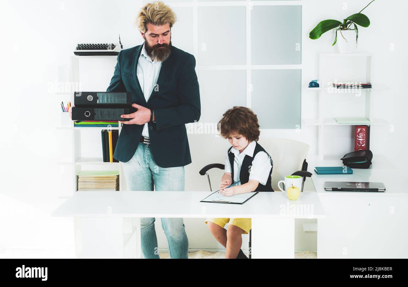 Little boss. Little Businessman bossy child working in office Stock ...