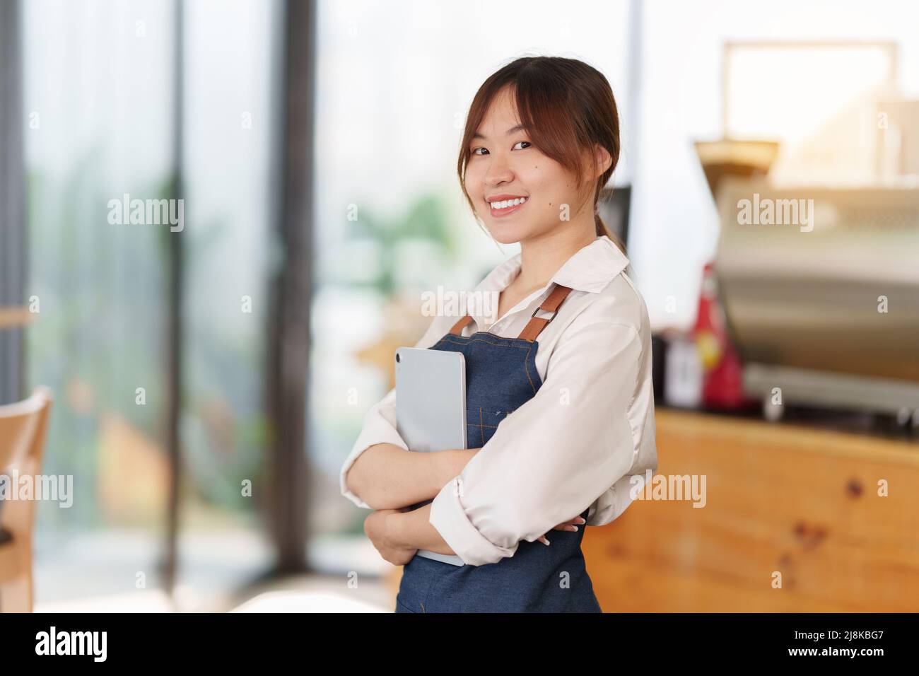 Asian Barista cafe owner smile while cafe open. SME entrepreneur seller ...