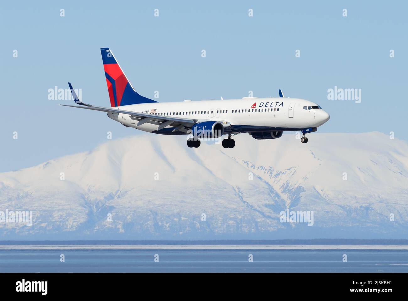 Delta Airlines Boeing 737 airplane on approach to Anchorage Airport in ...