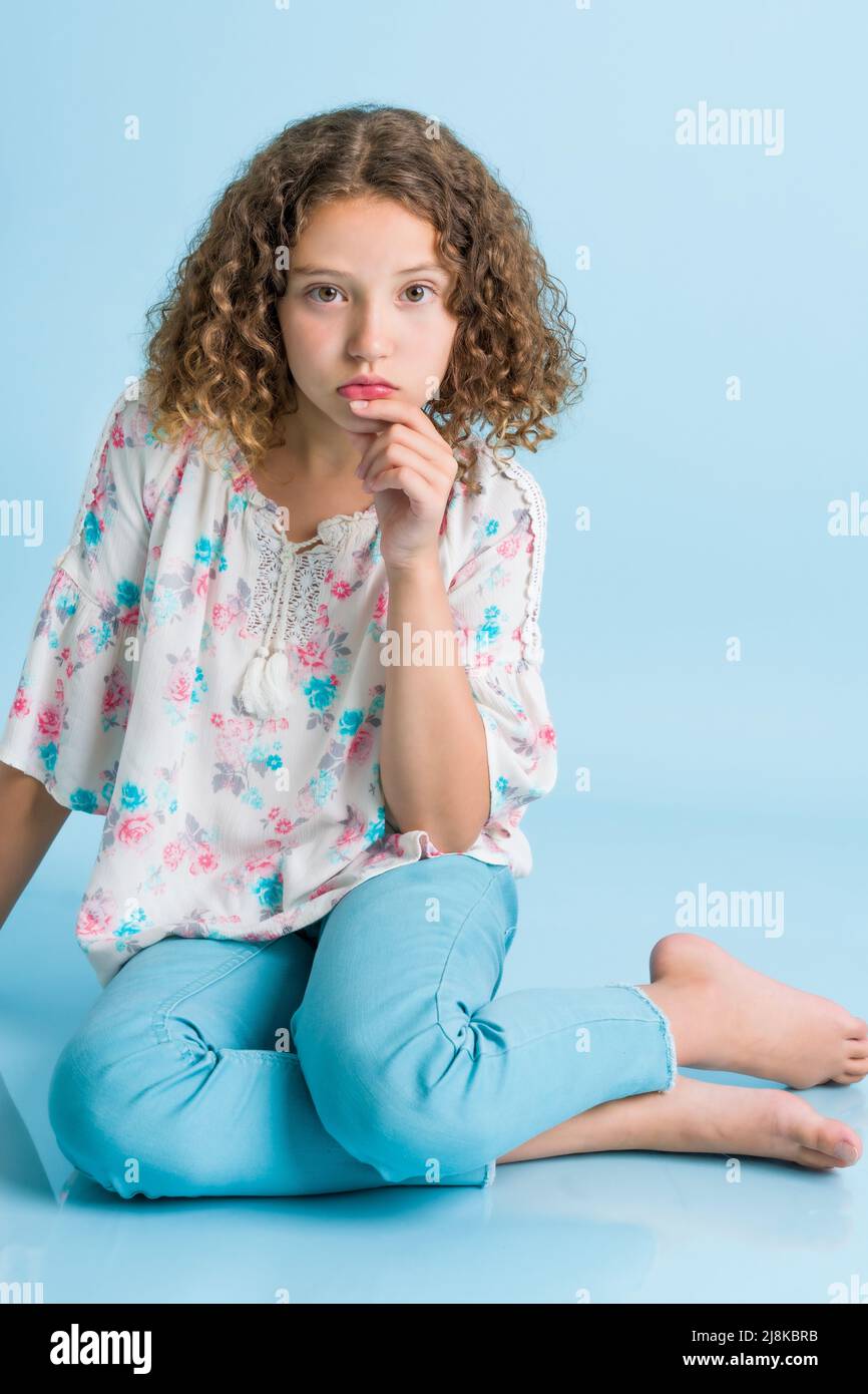 Kid sitting thinking hi-res stock photography and images - Alamy