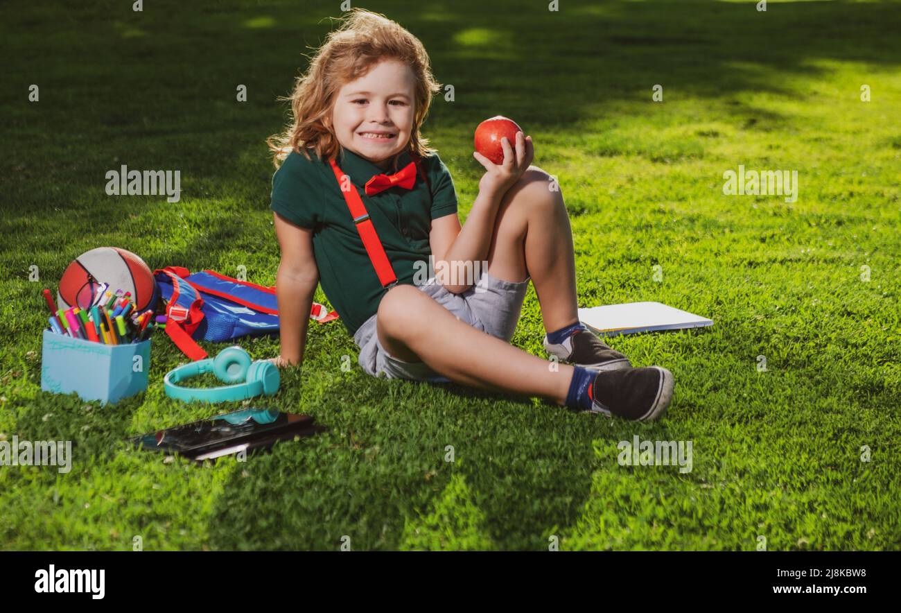 Kid studying online outdoor in park. Study in nature. Online school ...