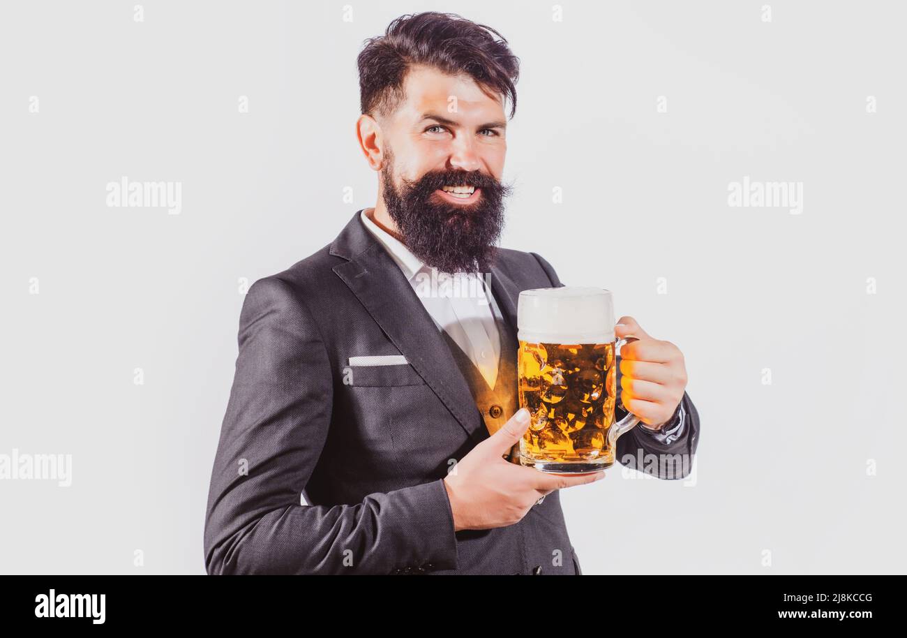 Handsome man in black suit drinking beer over white background Stock ...