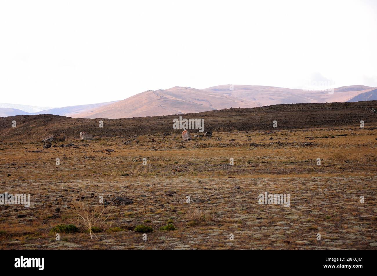 Ancient stone burials in the autumn desert steppe at the foot of the ...