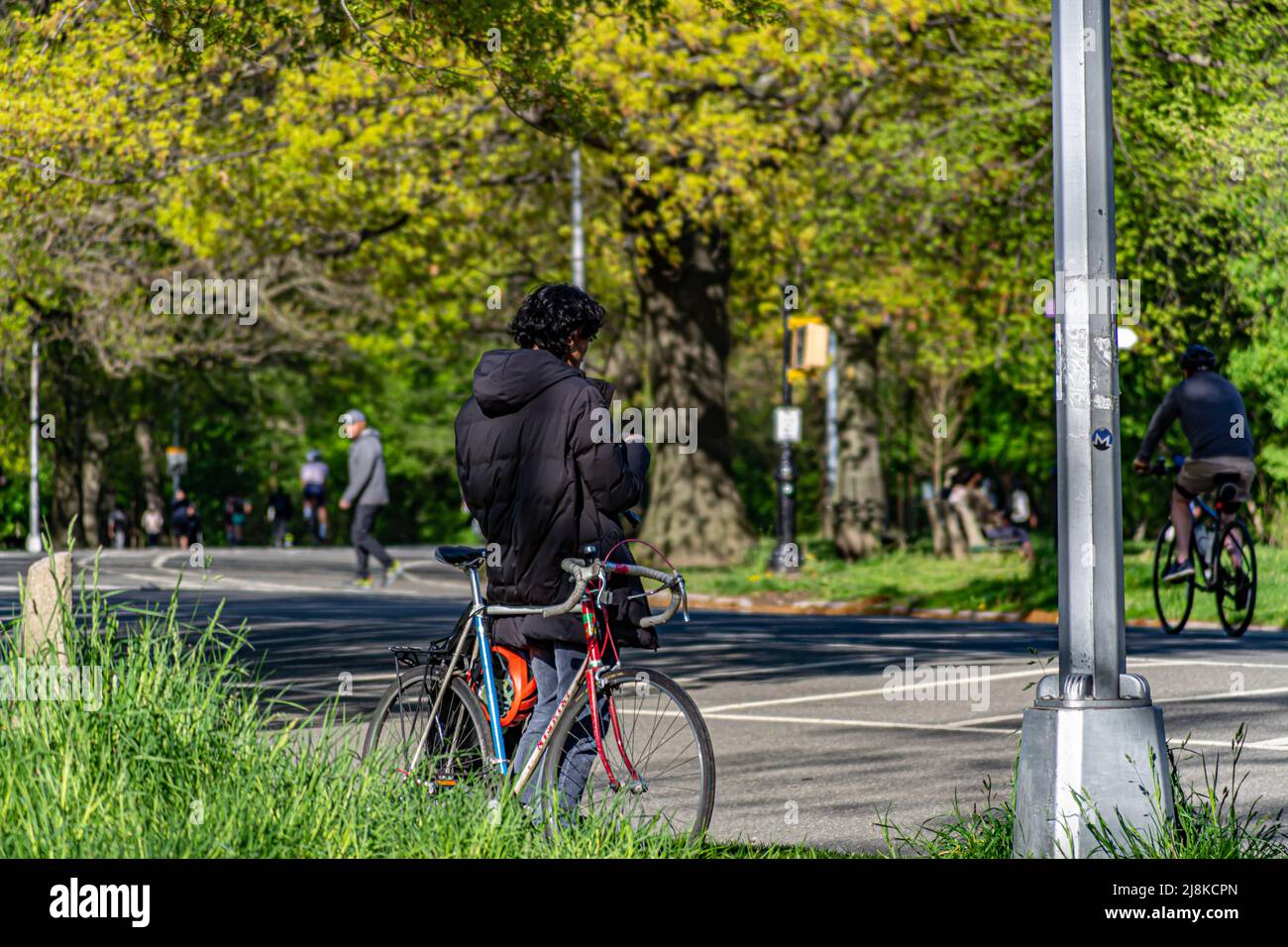 Serene park scene cyclist hi-res stock photography and images - Alamy