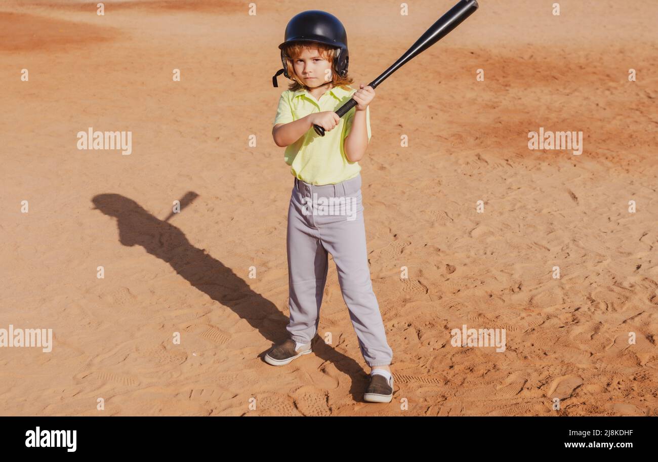 Kid holding a baseball bat. Pitcher child about to throw in youth ...