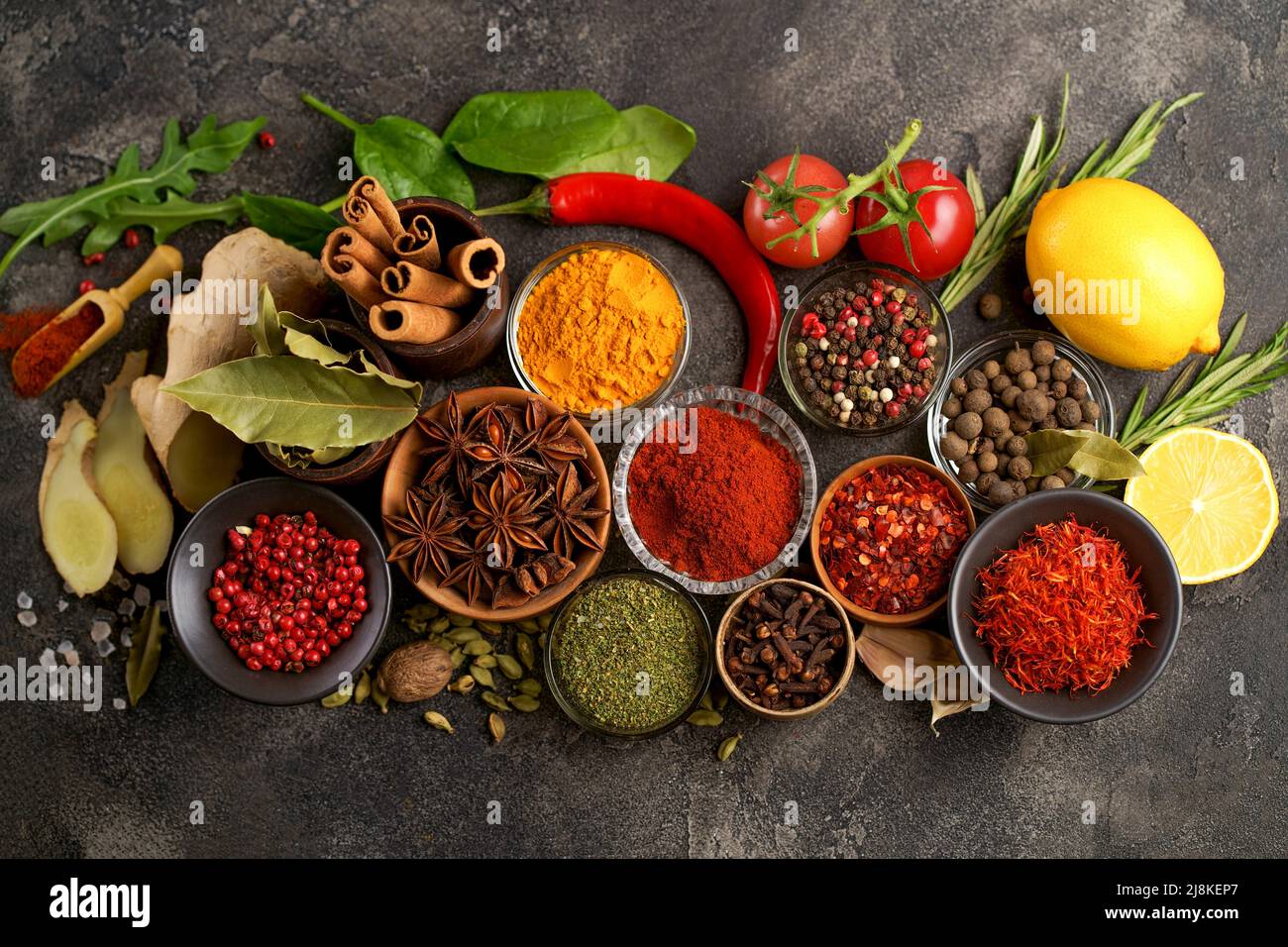 Assortment of natural spices on dark rustic stone background, Healthy ...
