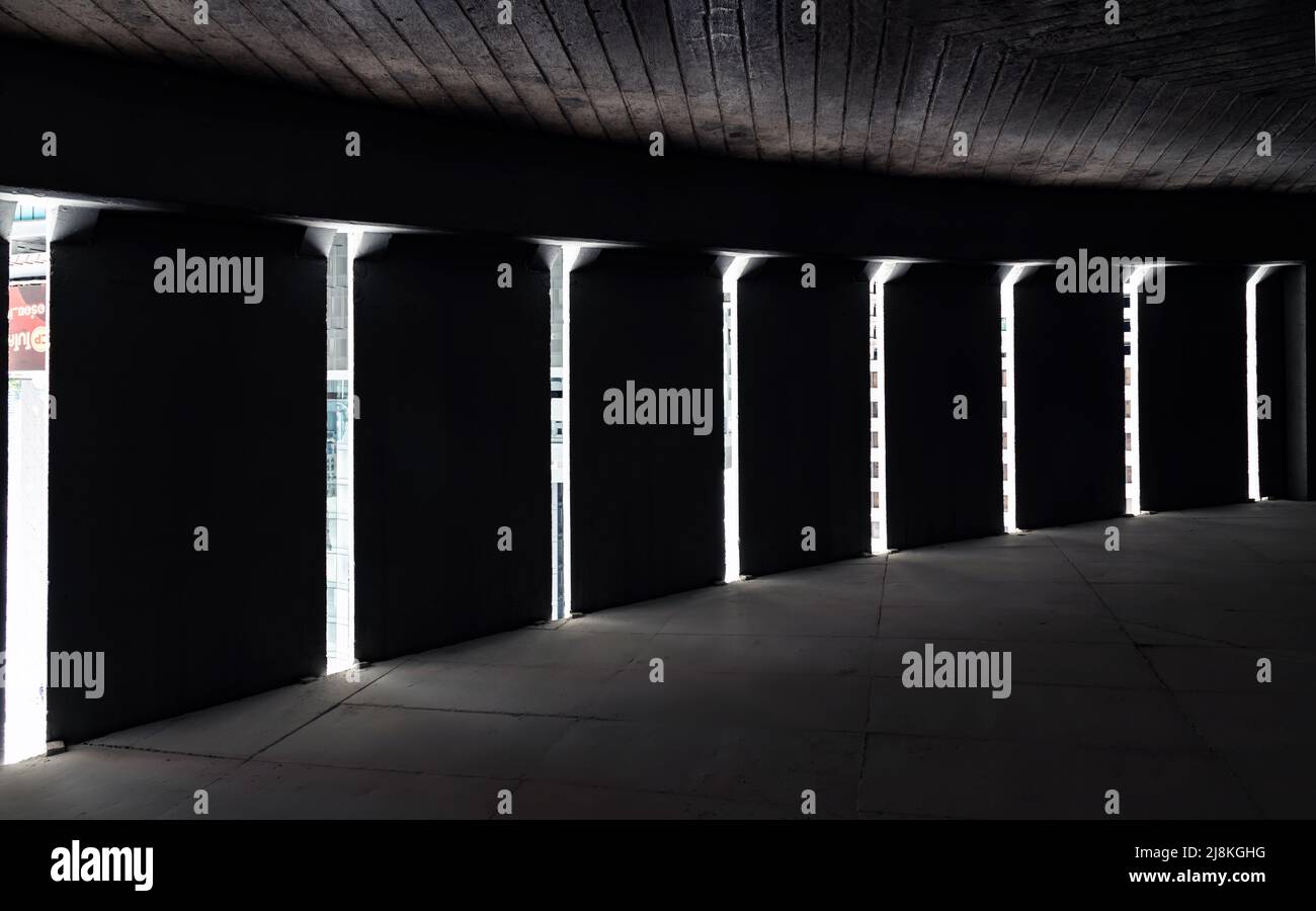 Light channels from cement wall of Curving shaped ramp on high building ...