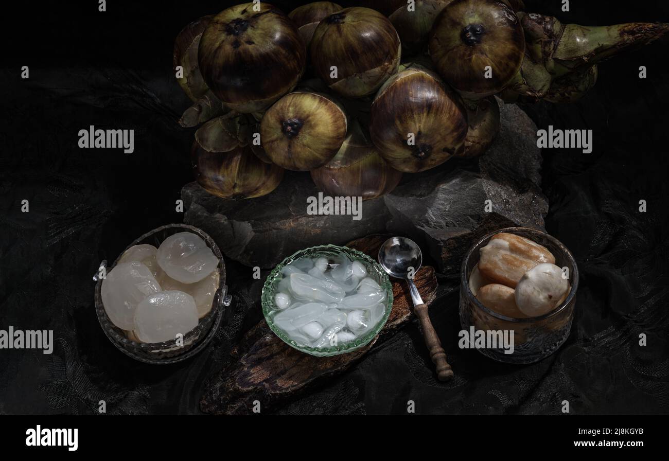 Sliced sweet fresh toddy palm with syrup and shaved ice in glass bowl ...