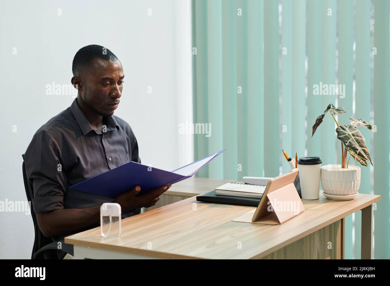 New employee watching educational video and studying technical ...