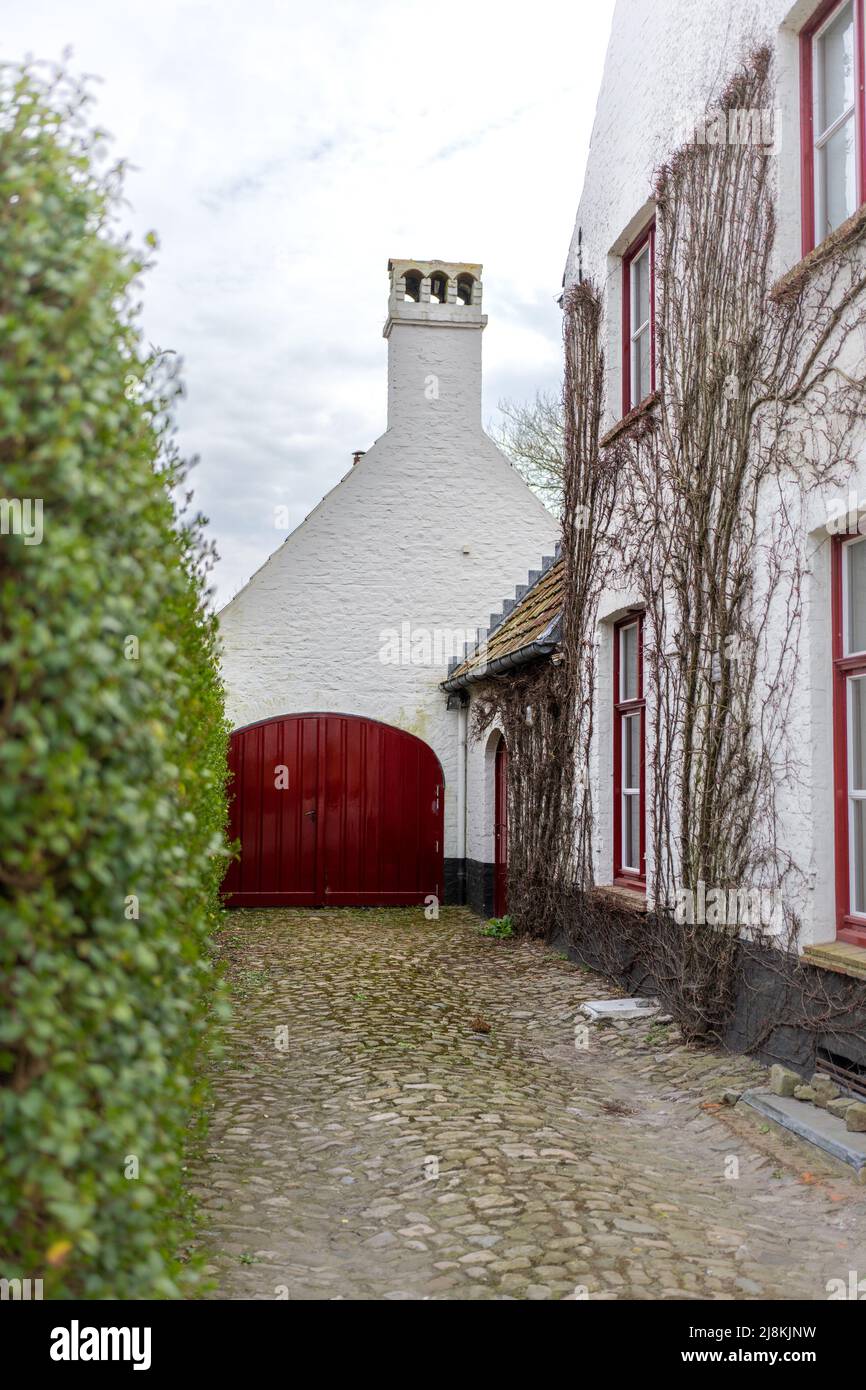 Quaint garage with red doors in a small village in Belgium Stock Photo ...