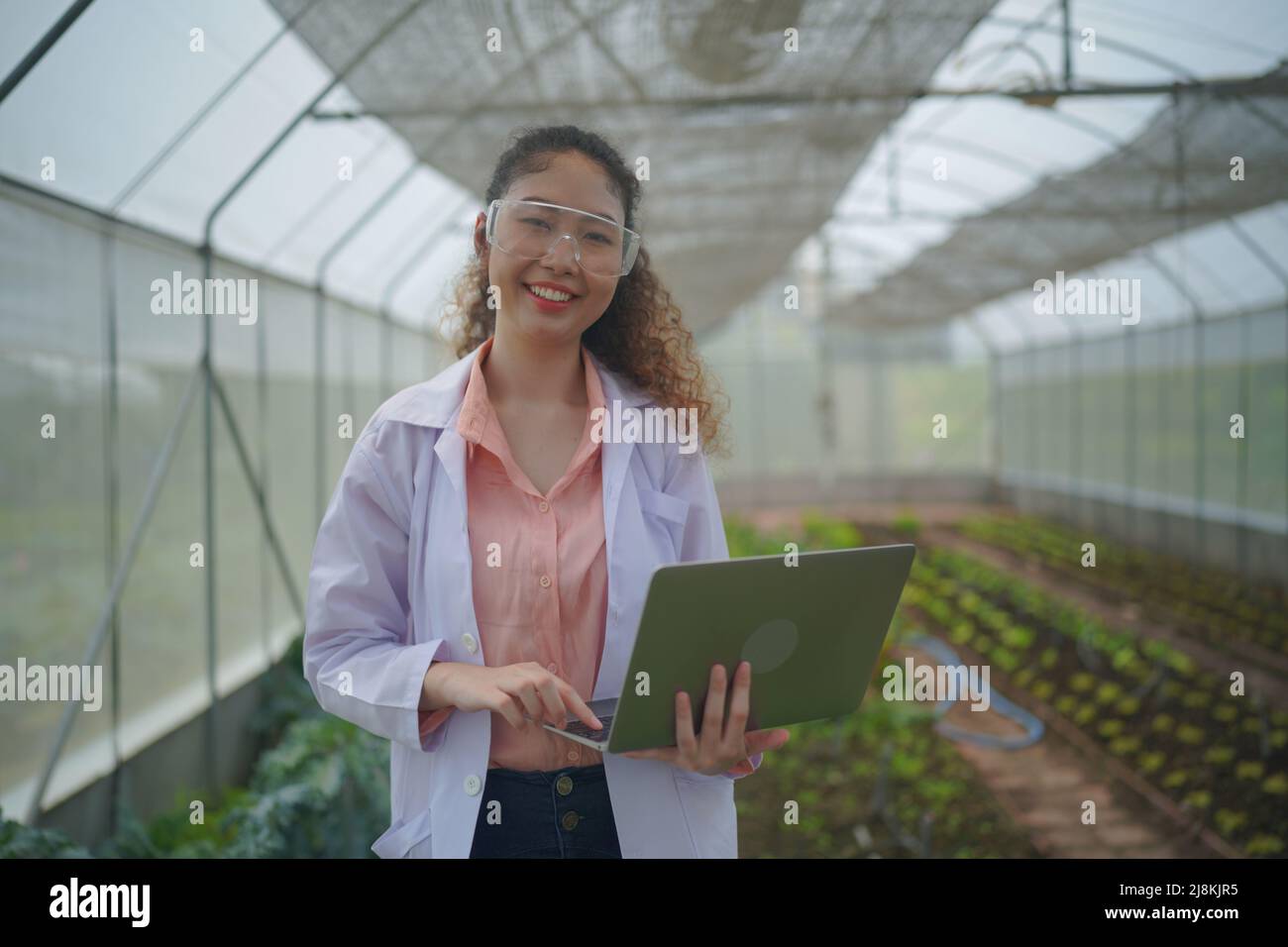 Agronomist farmer quality inspector holding are collecting data in ...