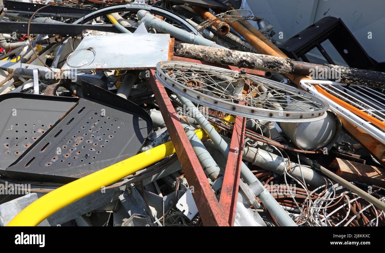 many scrap metal and rusty ferrous waste in a landfill for recyclable ...