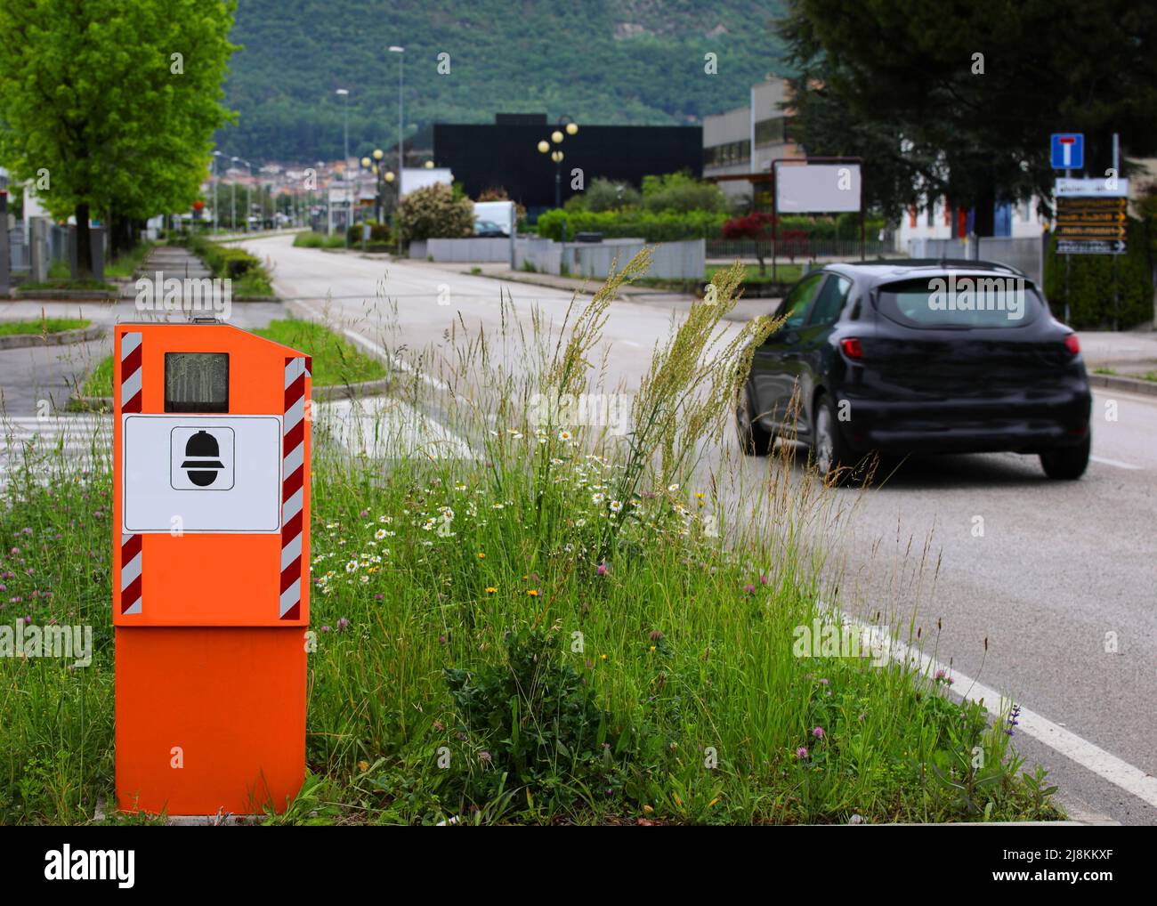 Safety Speed Cam and a black car on the road Stock Photo - Alamy