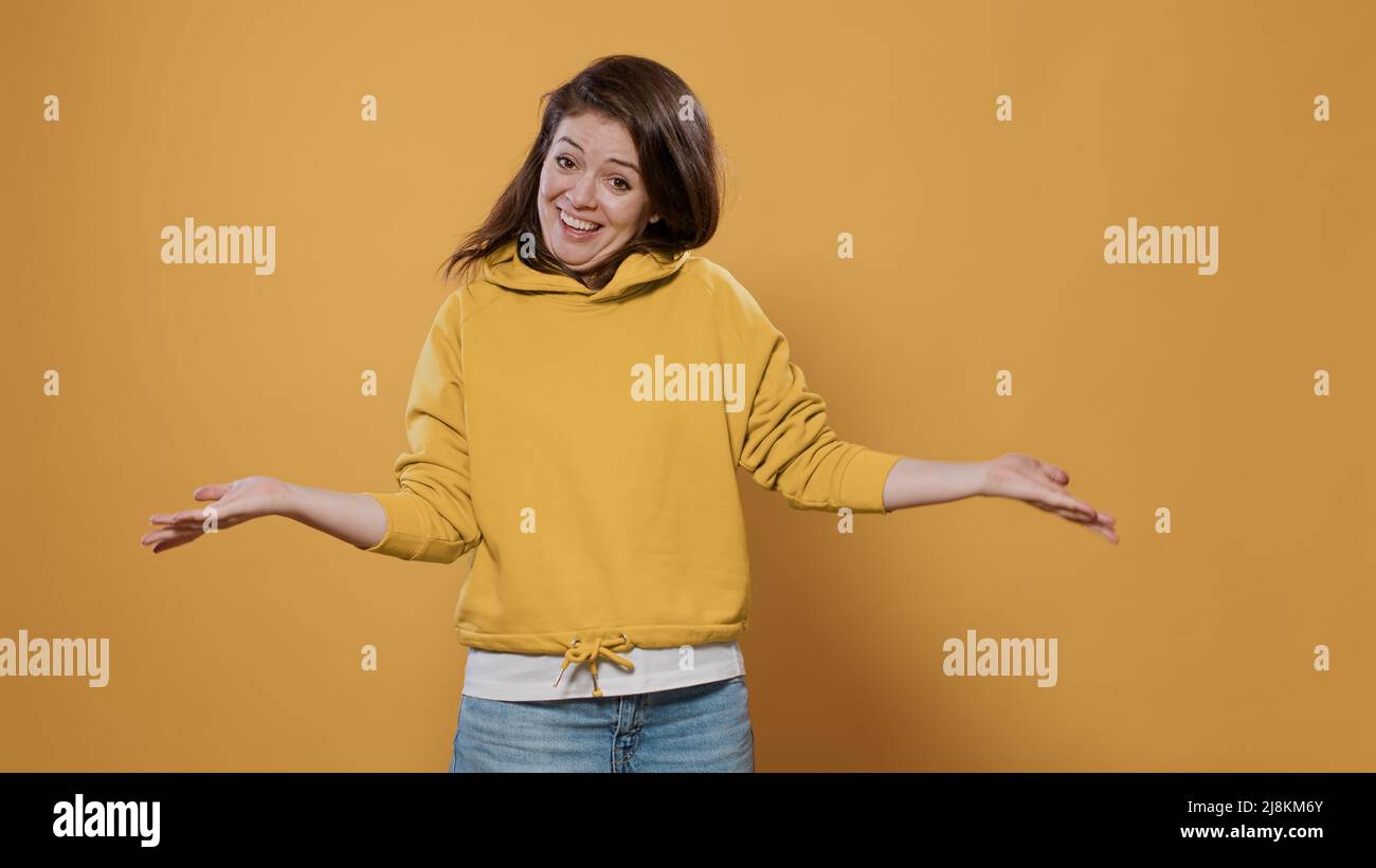 Surprised friendly woman doing hi-res stock photography and images - Alamy