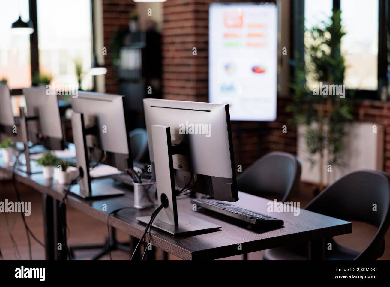 Empty call center helpdesk with multiple monitors in office, customer ...