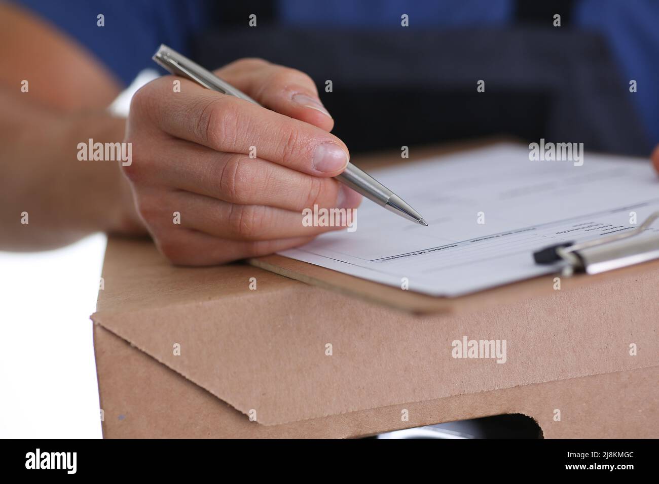 Man put signature on delivery receipt paper, got package from delivery ...