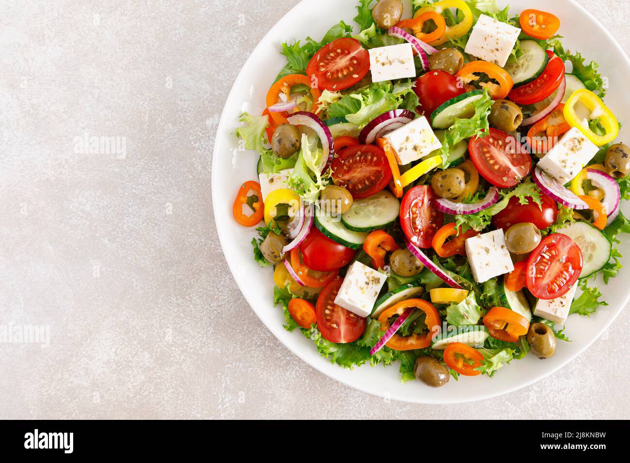 Greek salad with feta cheese, tomatoes, cucumbers, pepper, red onion ...