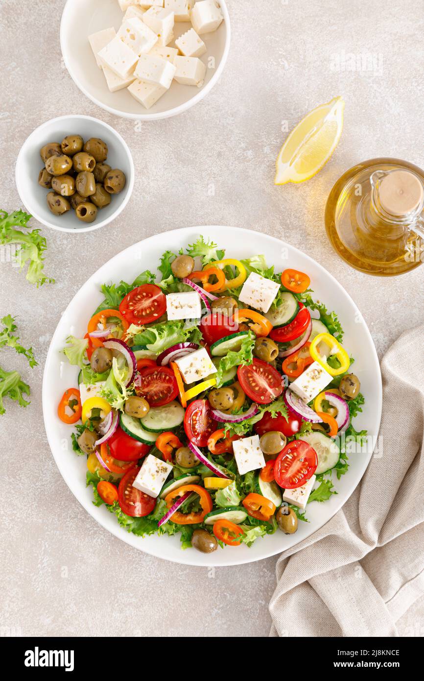 Greek salad with feta cheese, tomatoes, cucumbers, pepper, red onion ...