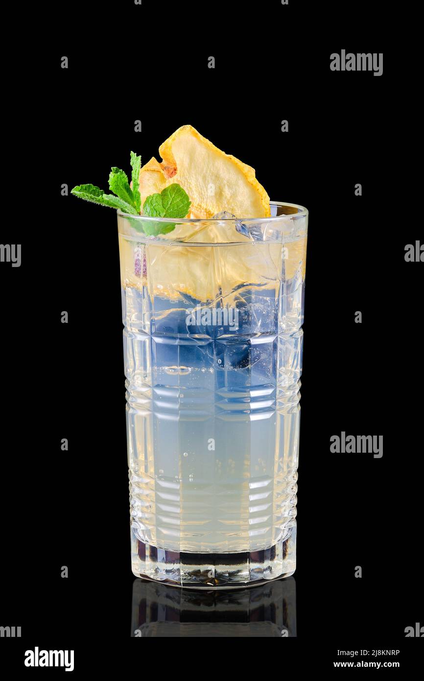 Cold pear lemonade isolated on black background Stock Photo - Alamy