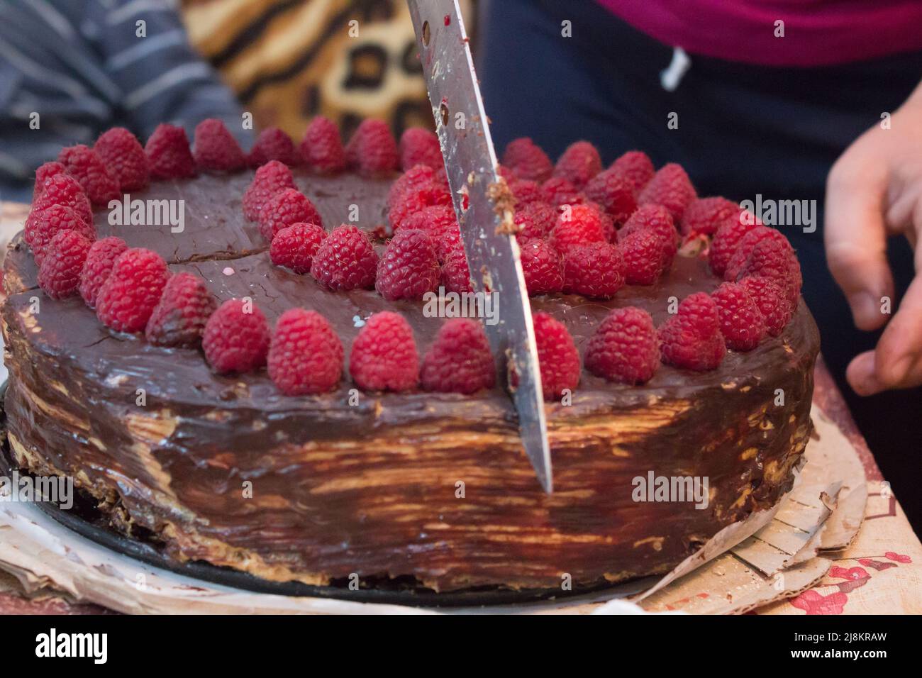 Female hand cutting chocolate cake hi-res stock photography and images ...