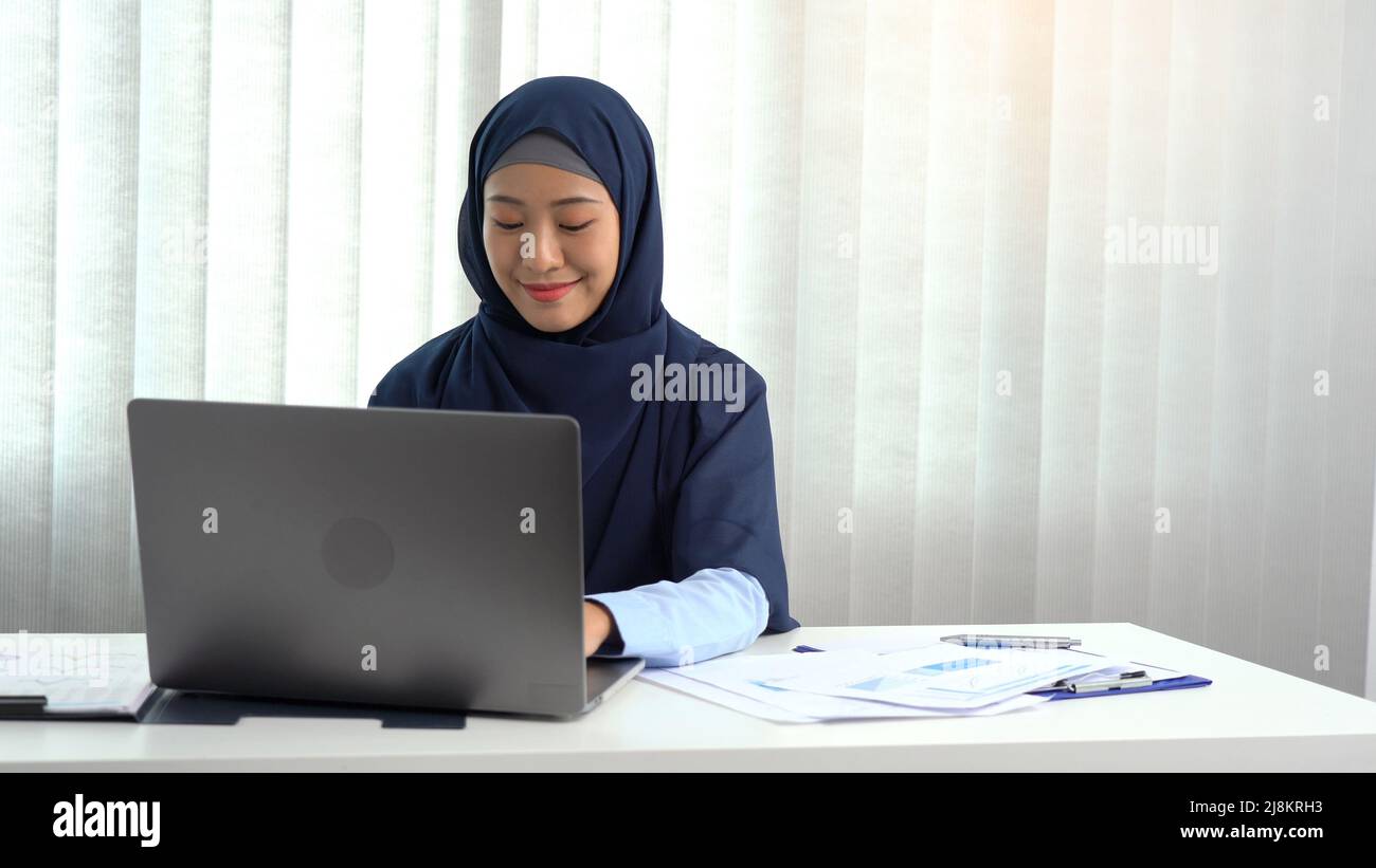 Serious young arab employee hi-res stock photography and images - Alamy