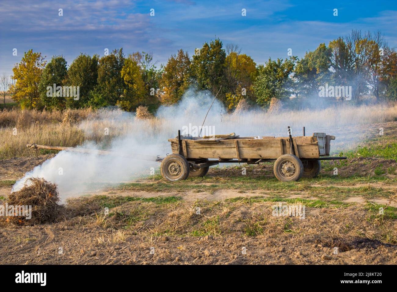 wooden cart in a field Stock Photo - Alamy