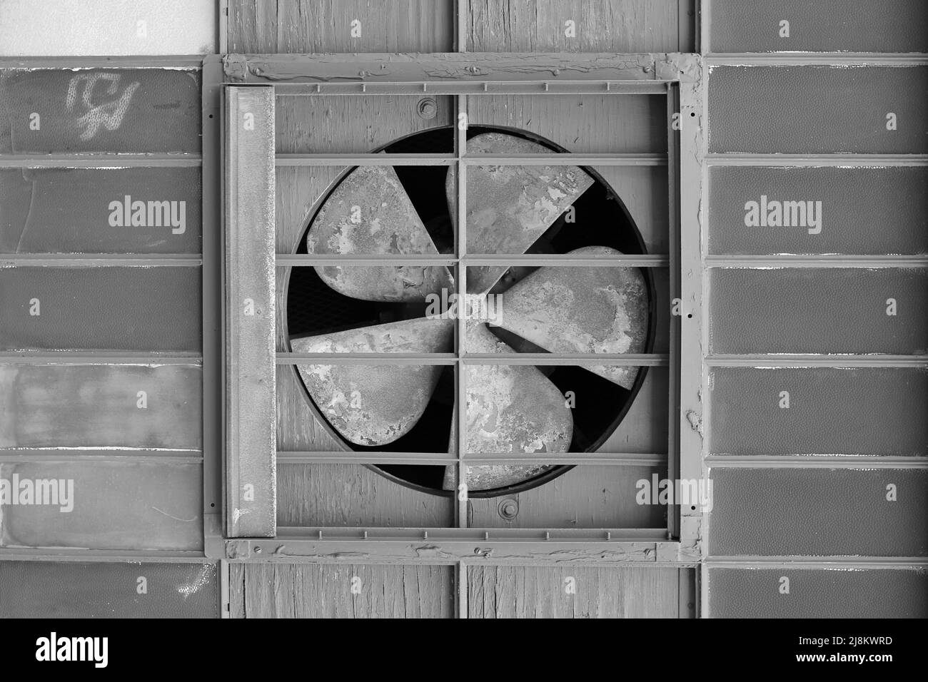 Vintage exhaust fan sitting on the abandoned factory window in black ...