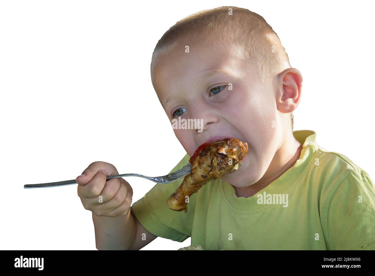 Boy eats chicken Stock Photo - Alamy