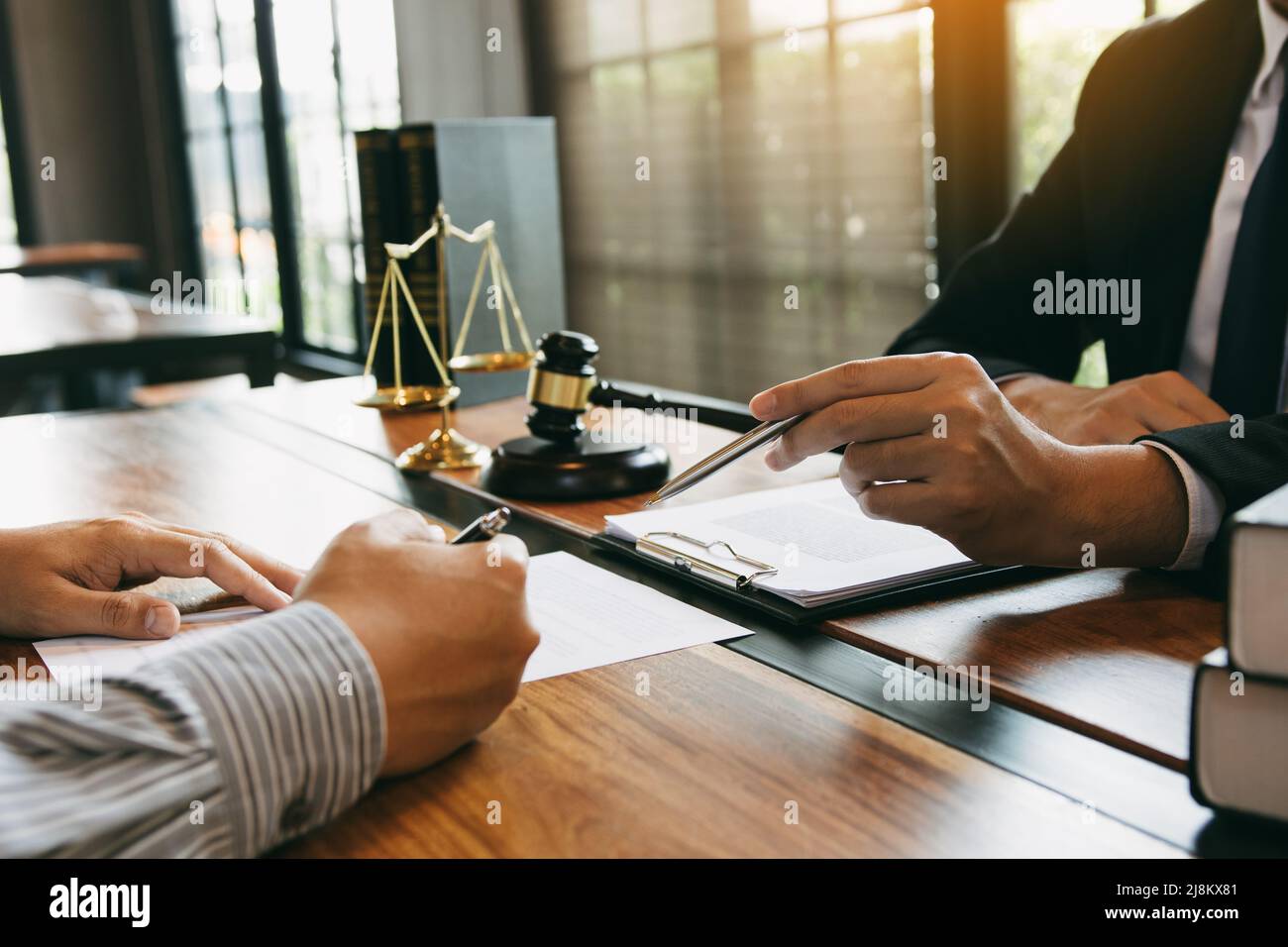 Lawyer is explaining about the wrongdoing laws regarding fraud to the ...