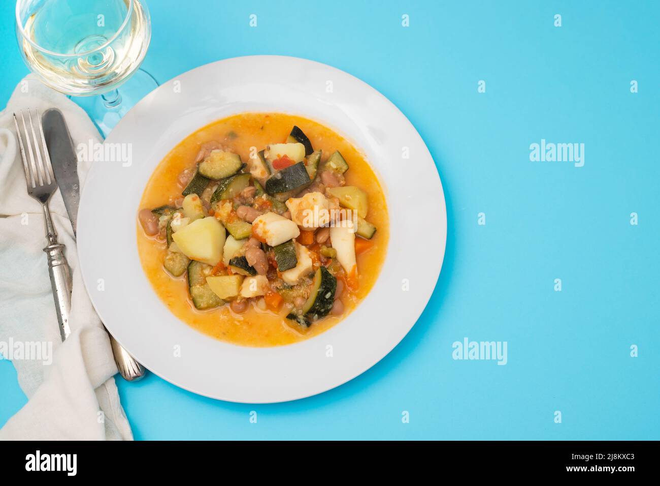 squid with with vegetables and sauce on the plate Stock Photo - Alamy