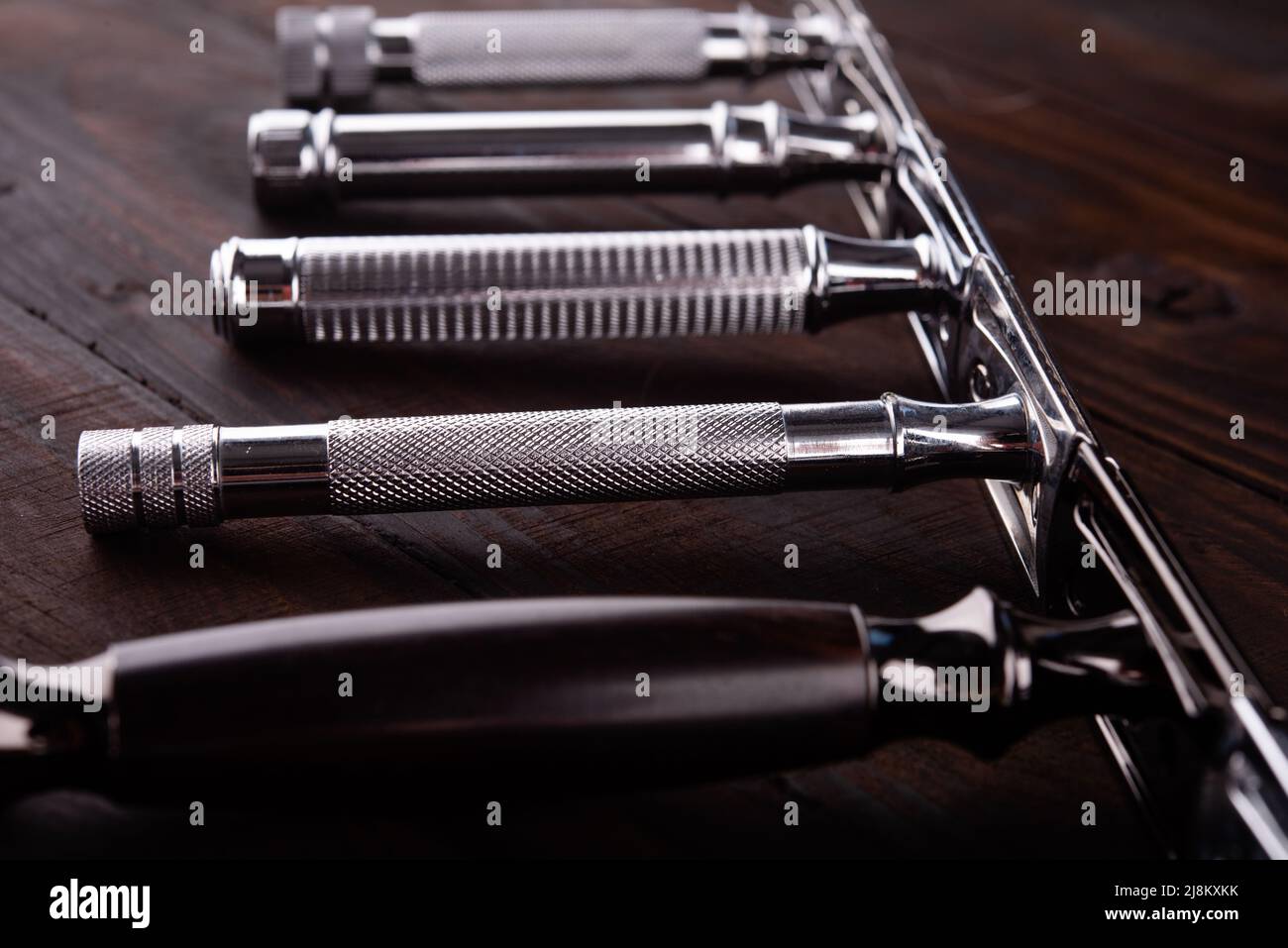 Set of razors on wooden background Stock Photo - Alamy