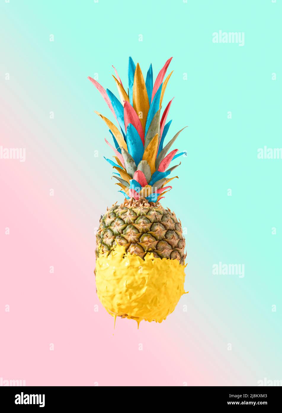 Creative Summer colorful pineapple fruit dripped in yellow paint. Tasty ...