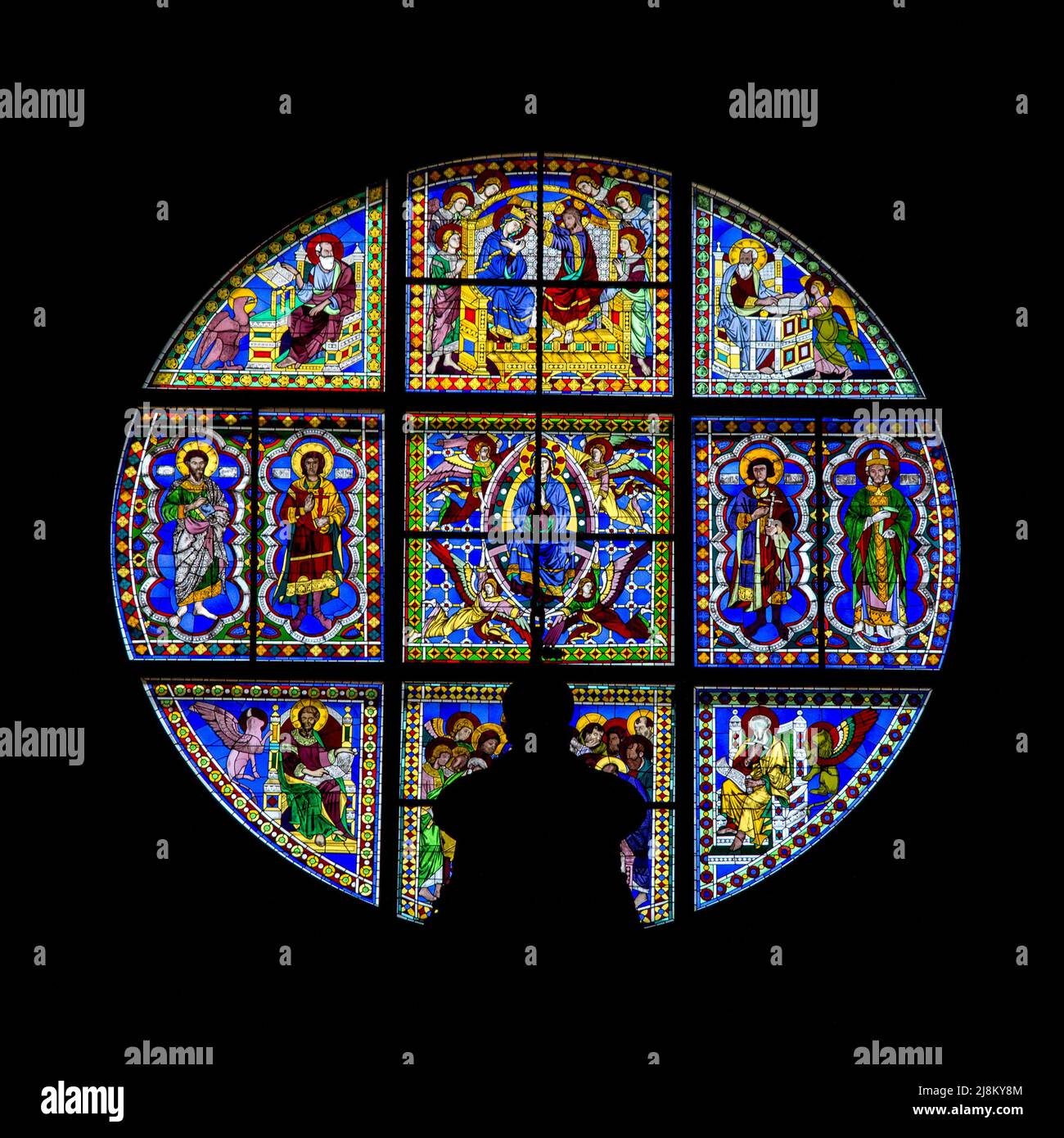 Light through stained glass rosettes, representing religious images ...