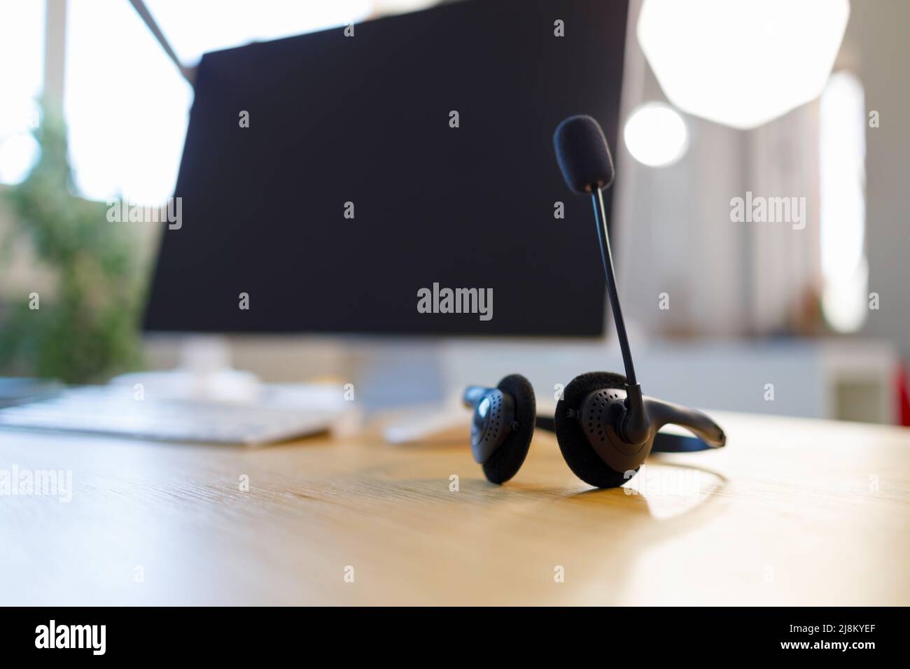 Call center headset device and computer at the office desk Stock Photo ...