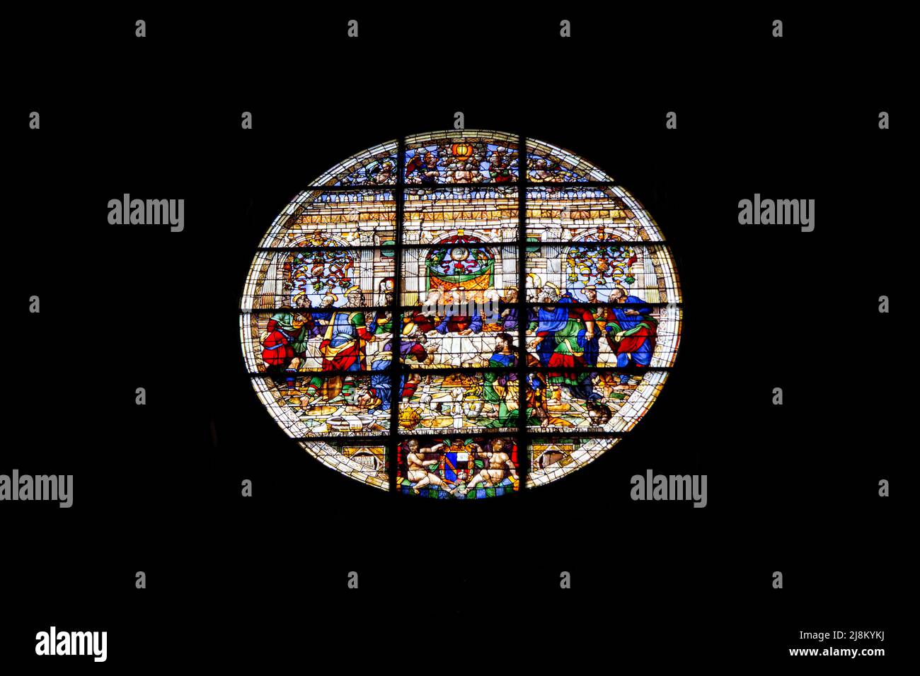 Light through stained glass rosettes, representing religious images ...