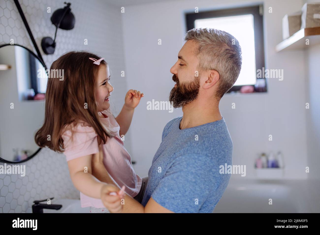 Happy father with his little daughter in bathroom, morning routine concept Stock Photo - Alamy