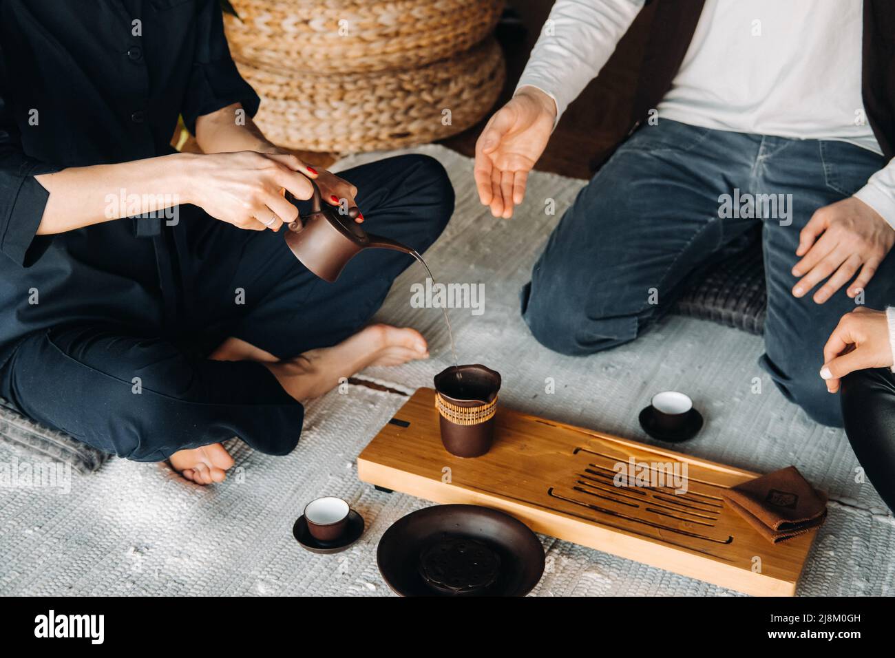 Preparing for a tea ceremony with a large company Stock Photo - Alamy