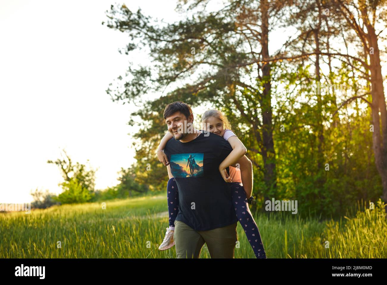 Giving piggyback ride hi-res stock photography and images - Alamy