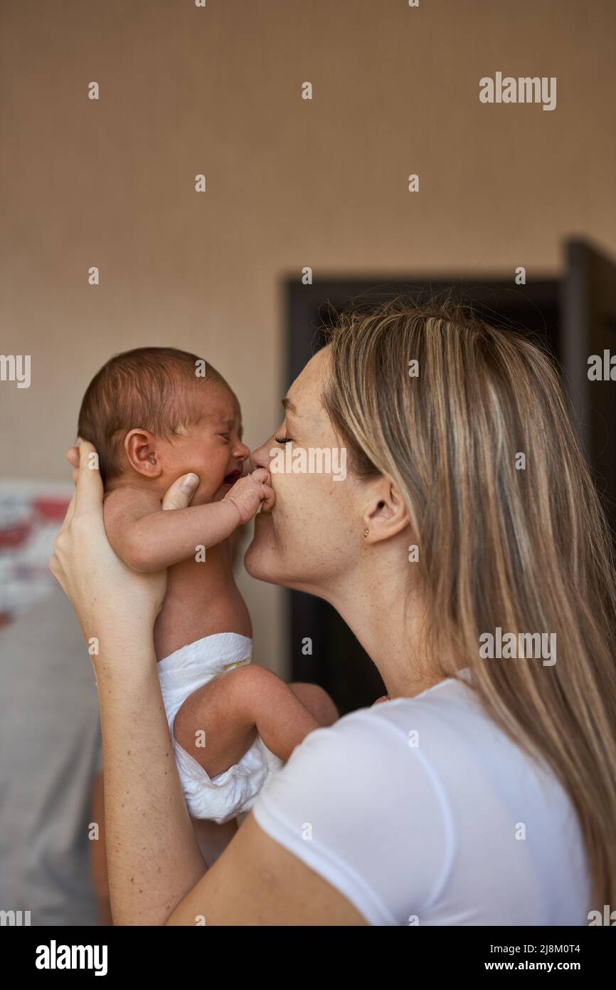 Mother holding newborn baby hi-res stock photography and images - Alamy