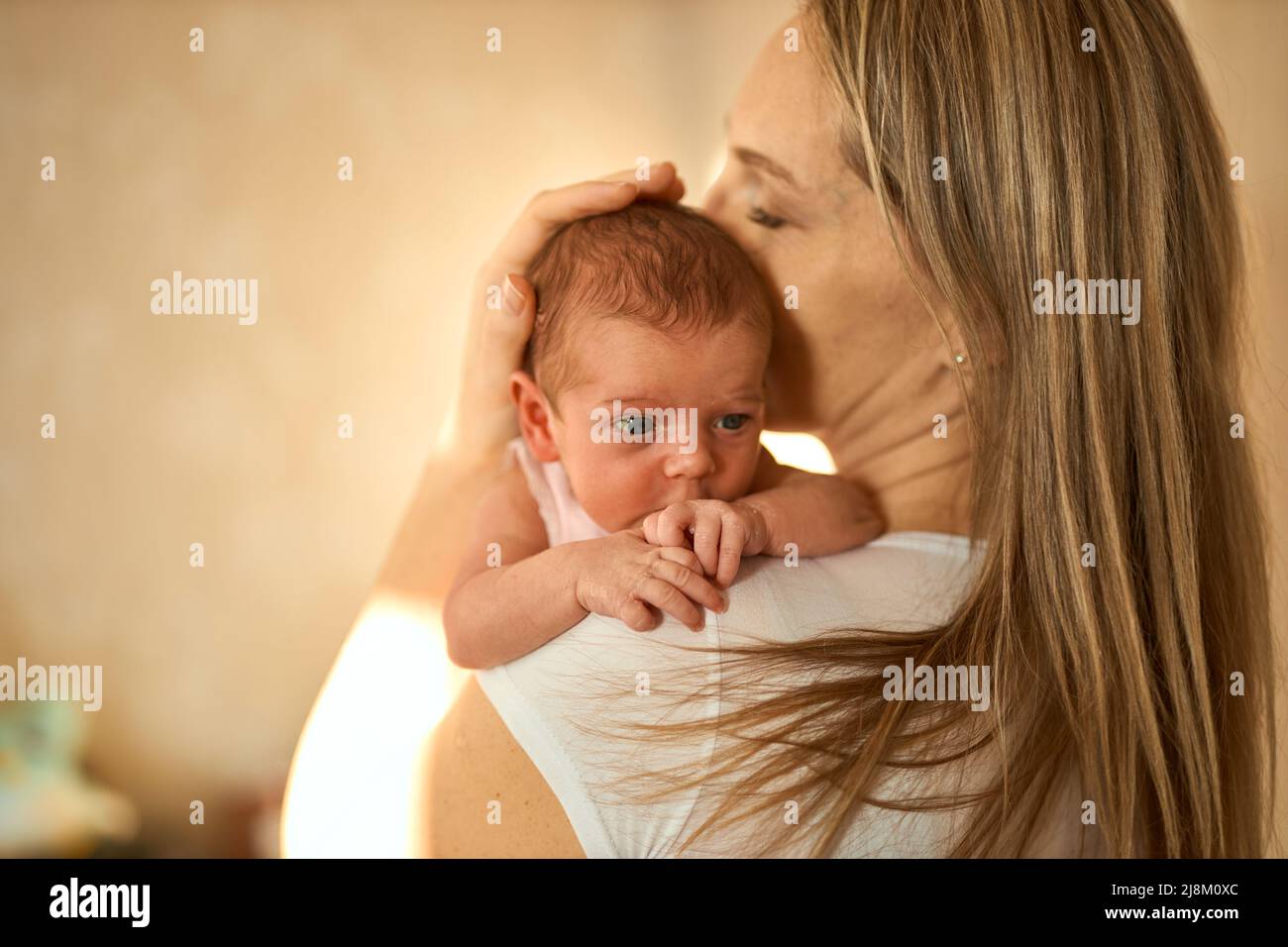 Mother holding her newborn baby in hands Stock Photo - Alamy