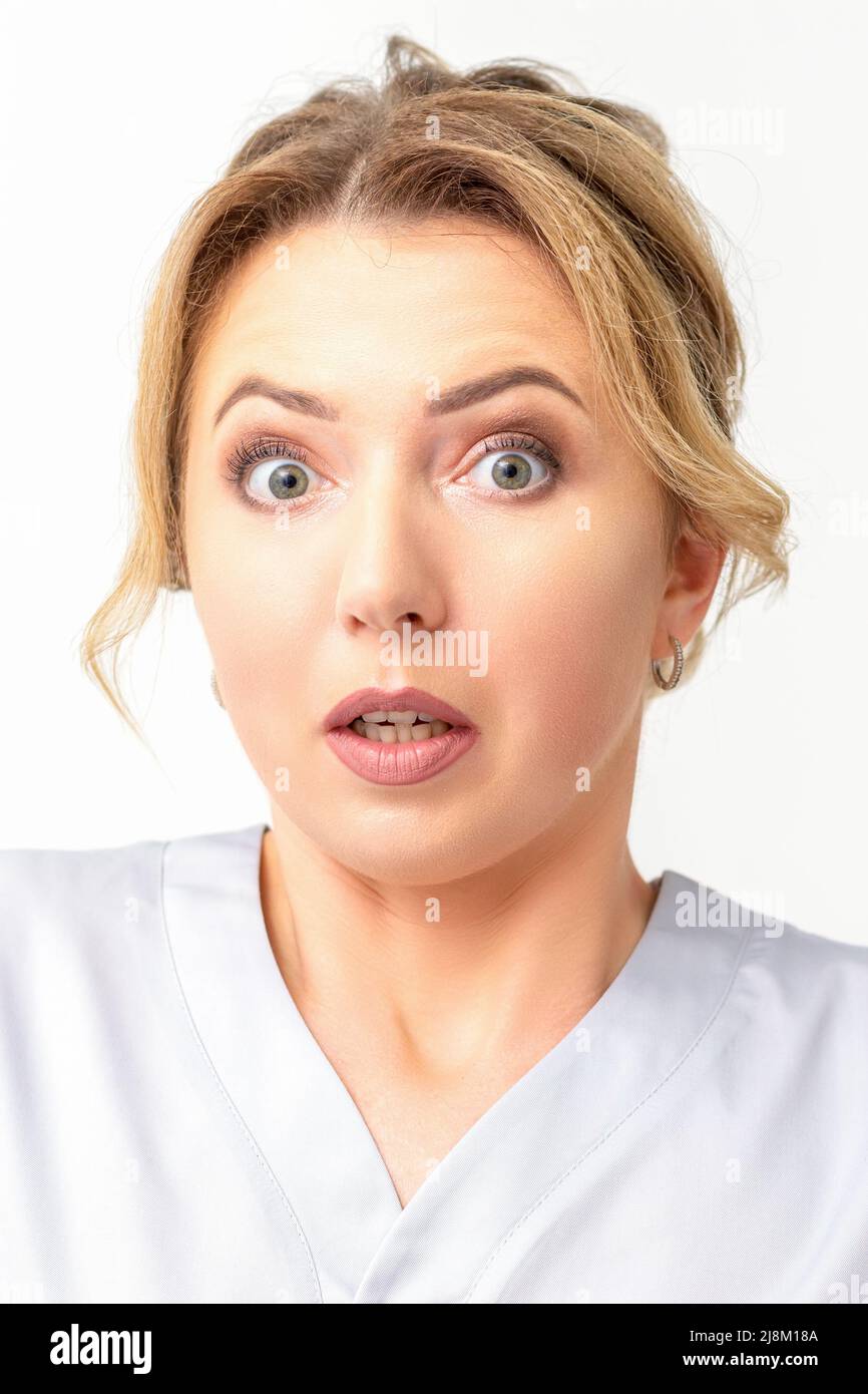 Female doctor shocked. Close up portrait of a young caucasian woman ...