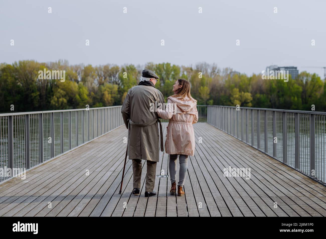 Rear view of a man walking with a stick hi-res stock photography and ...