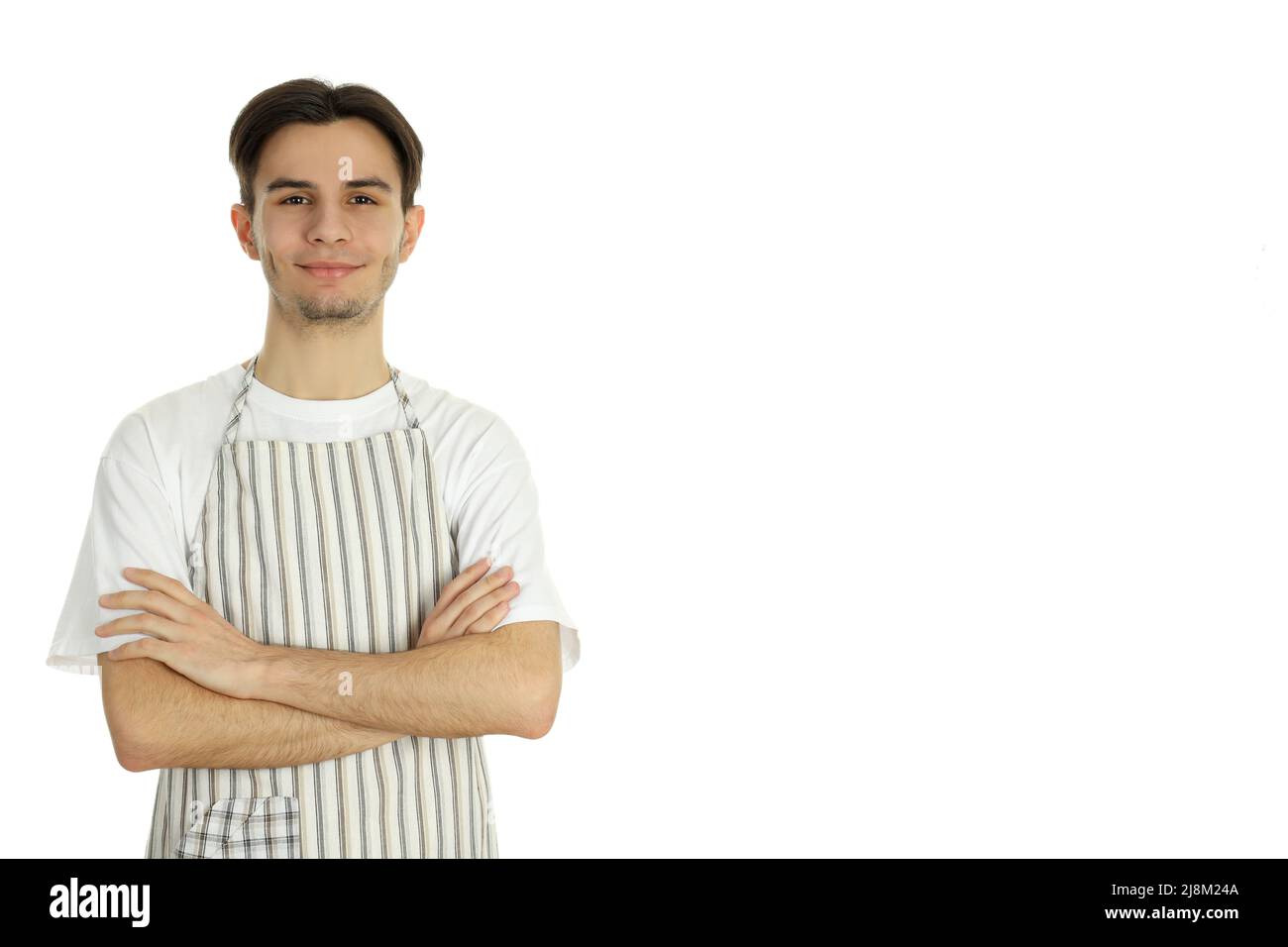 Concept of cooking, young man chef isolated on white background Stock ...
