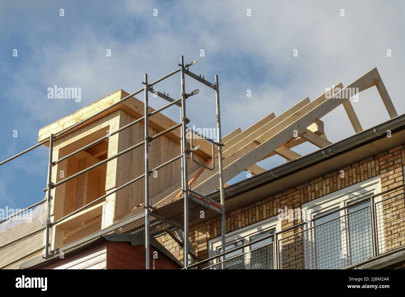 dormer installation on the rooftop of a apartment house Stock Photo - Alamy