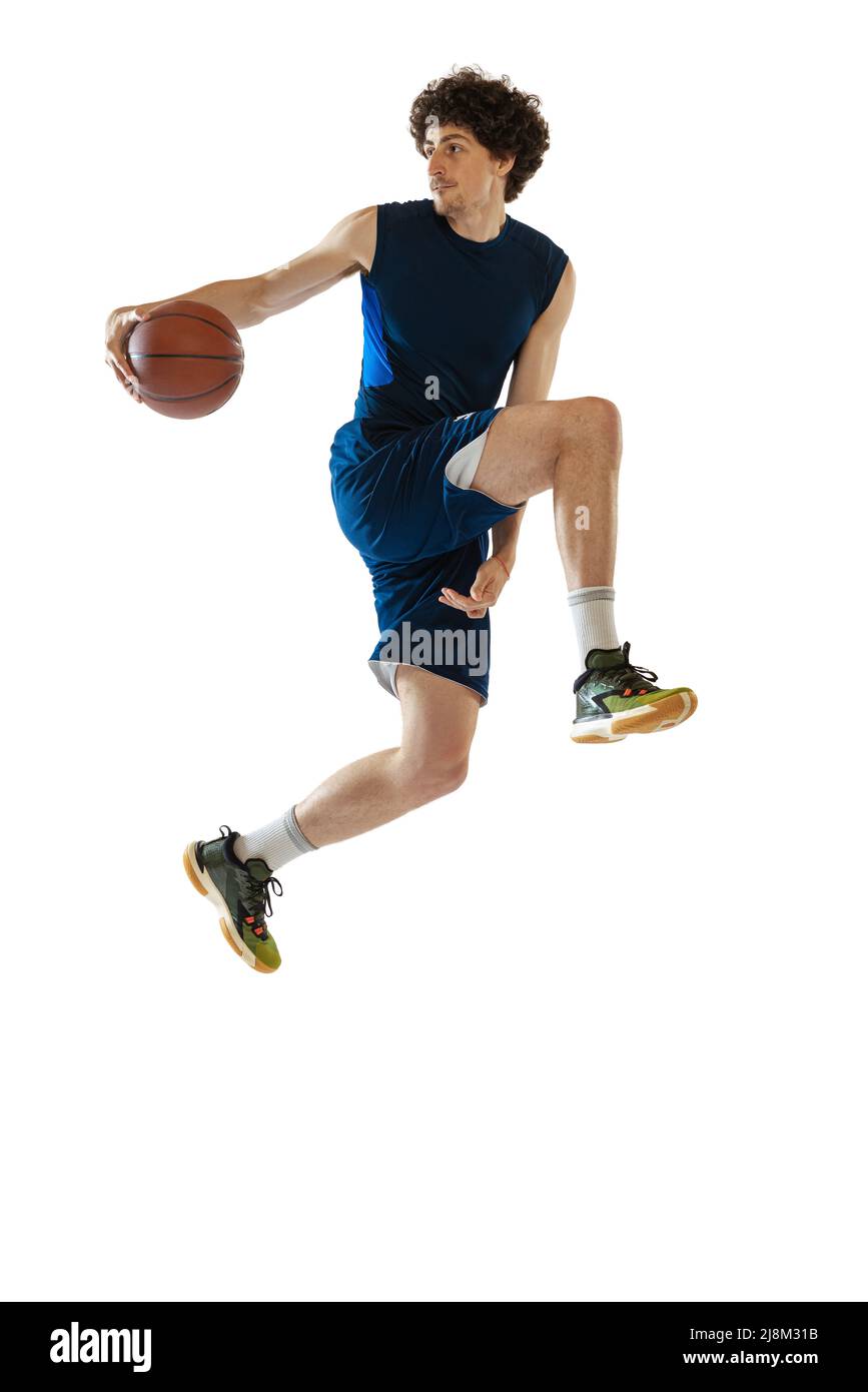 Young muscular basketball player in action, motion isolated on white ...