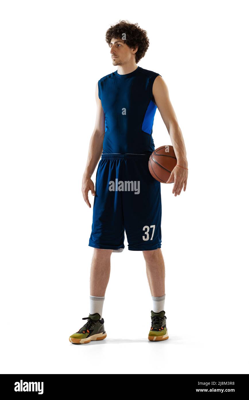 Full-length portrait of young muscular basketball player posing ...