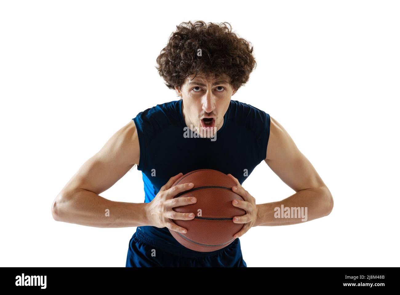 Winner. Portrait of young muscular basketball player posing isolated on ...