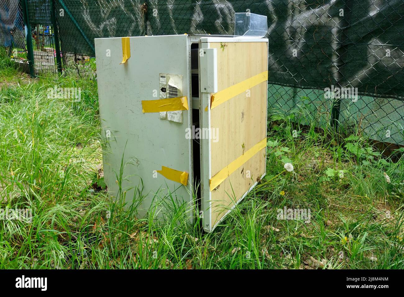 Discarded old broken fridge, Berlin, Germany Stock Photo - Alamy