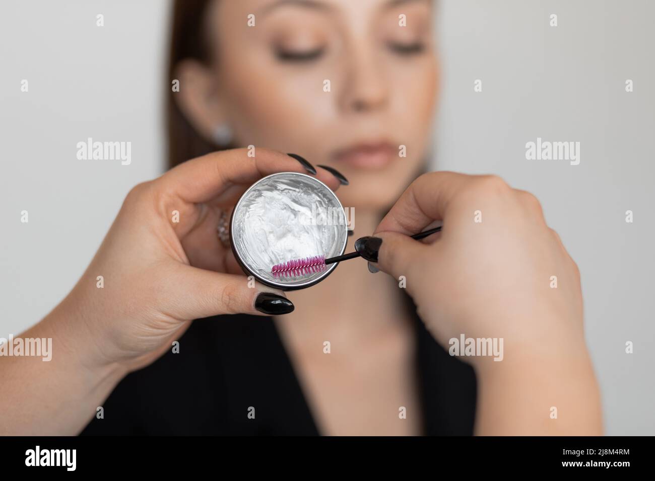 Blurred woman face with clear healthy skin, laying and correcting ...